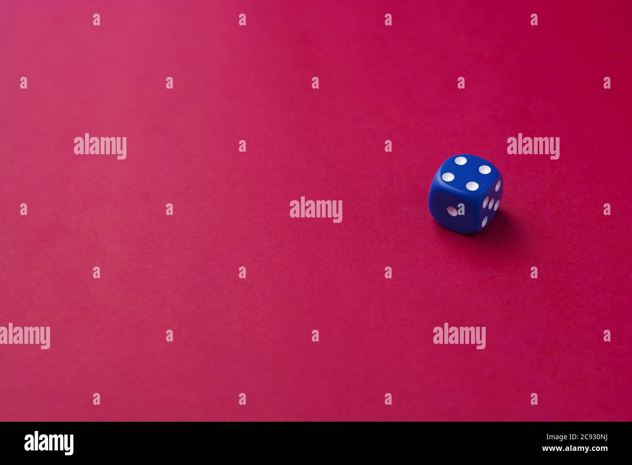 Overhead shot of blue dice isolated on a pink background Stock Photo ...