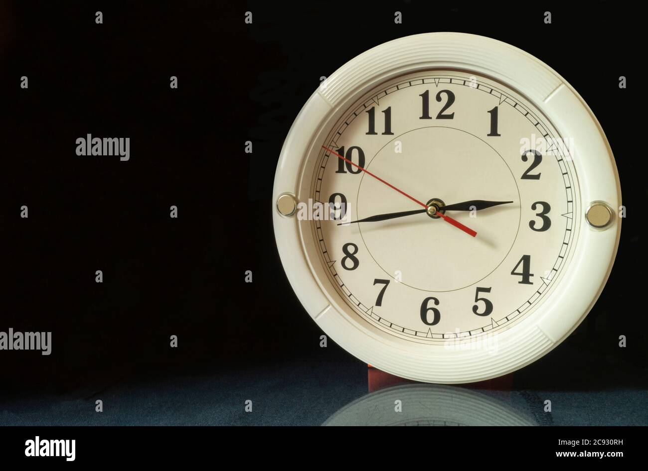 The White watch with reflection on black background. Round dial with ...