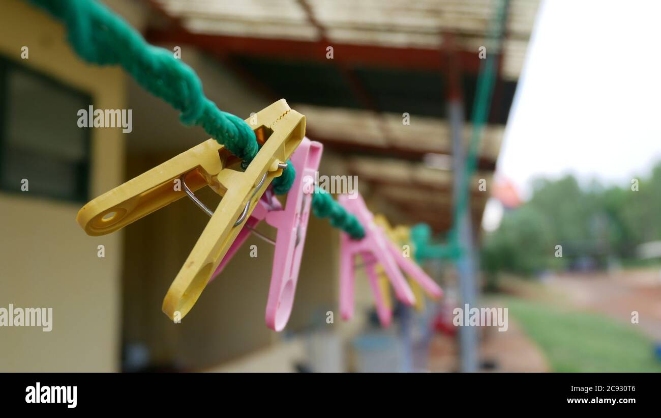 set of clothes pin on rope Stock Photo - Alamy
