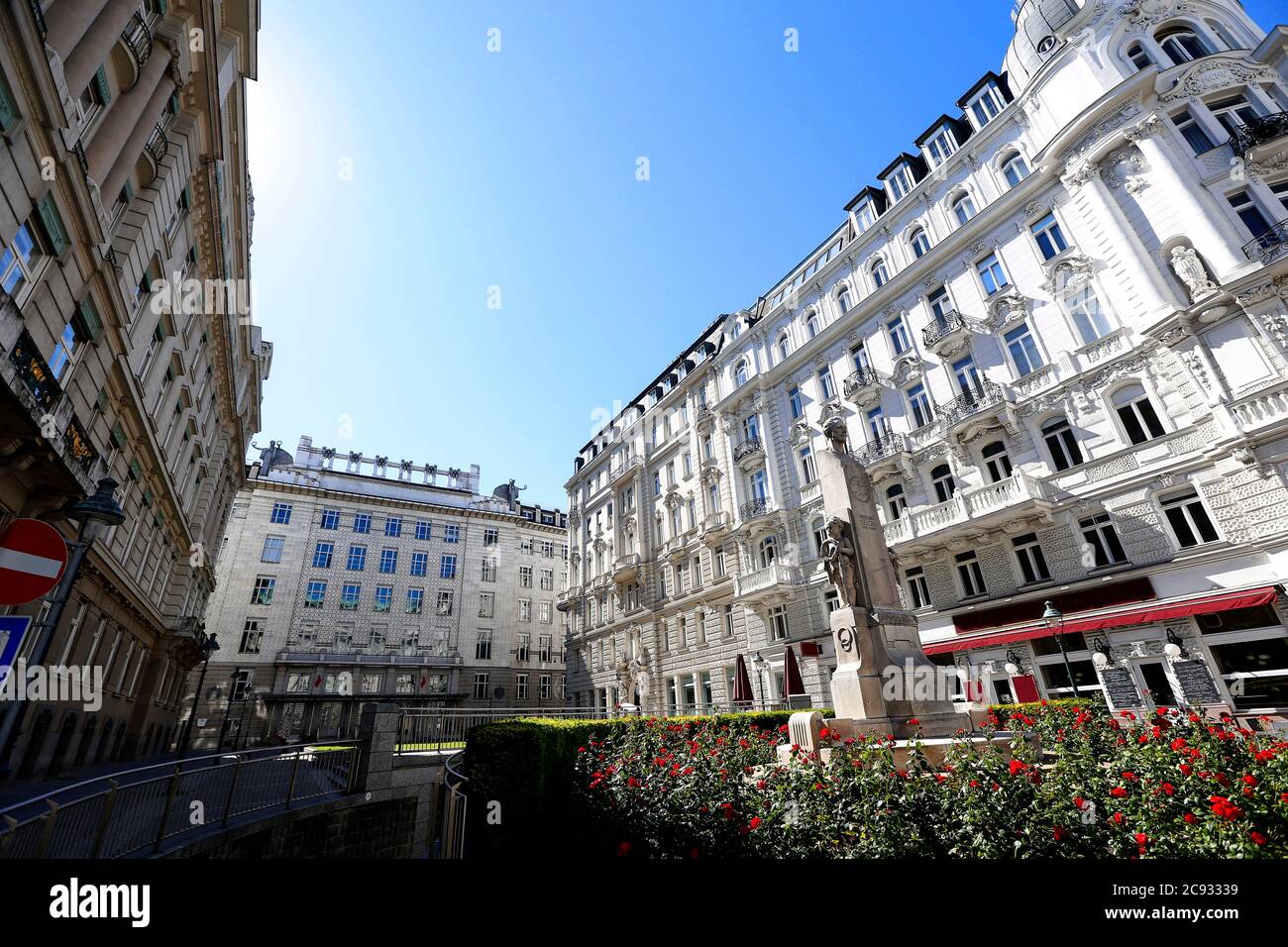 Square with red roses and residential buildings on background in Vienna ...