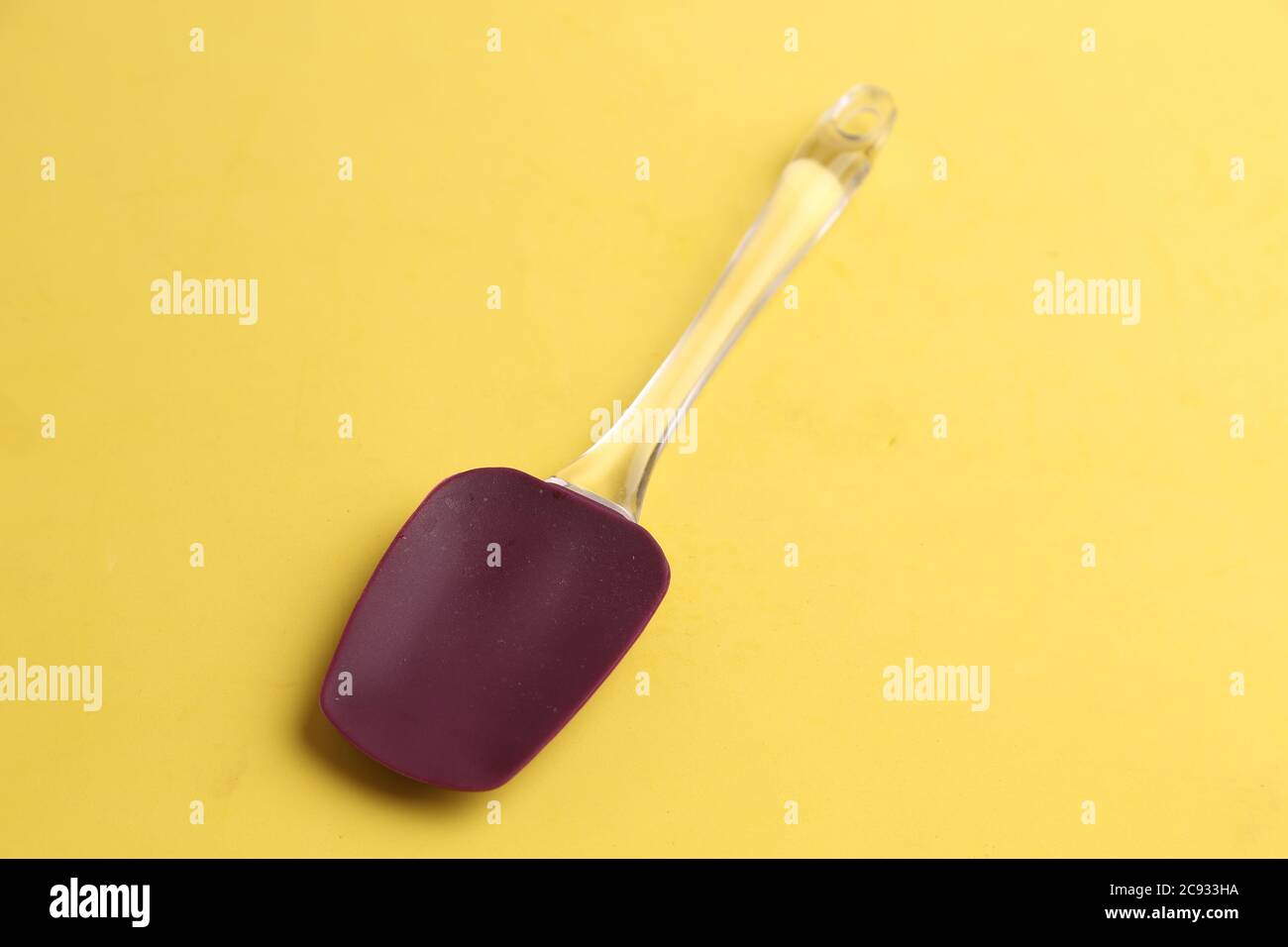 Kitchen spatula for baking isolated on a yellow background Stock Photo ...