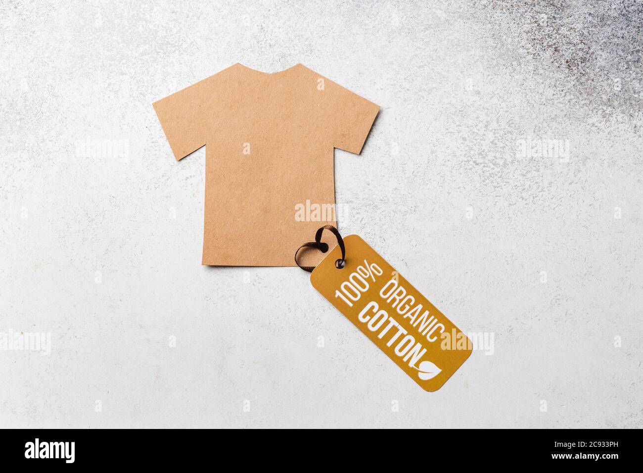Organic cotton clothing concept with label. Paper craft t-shirt. Eco ...