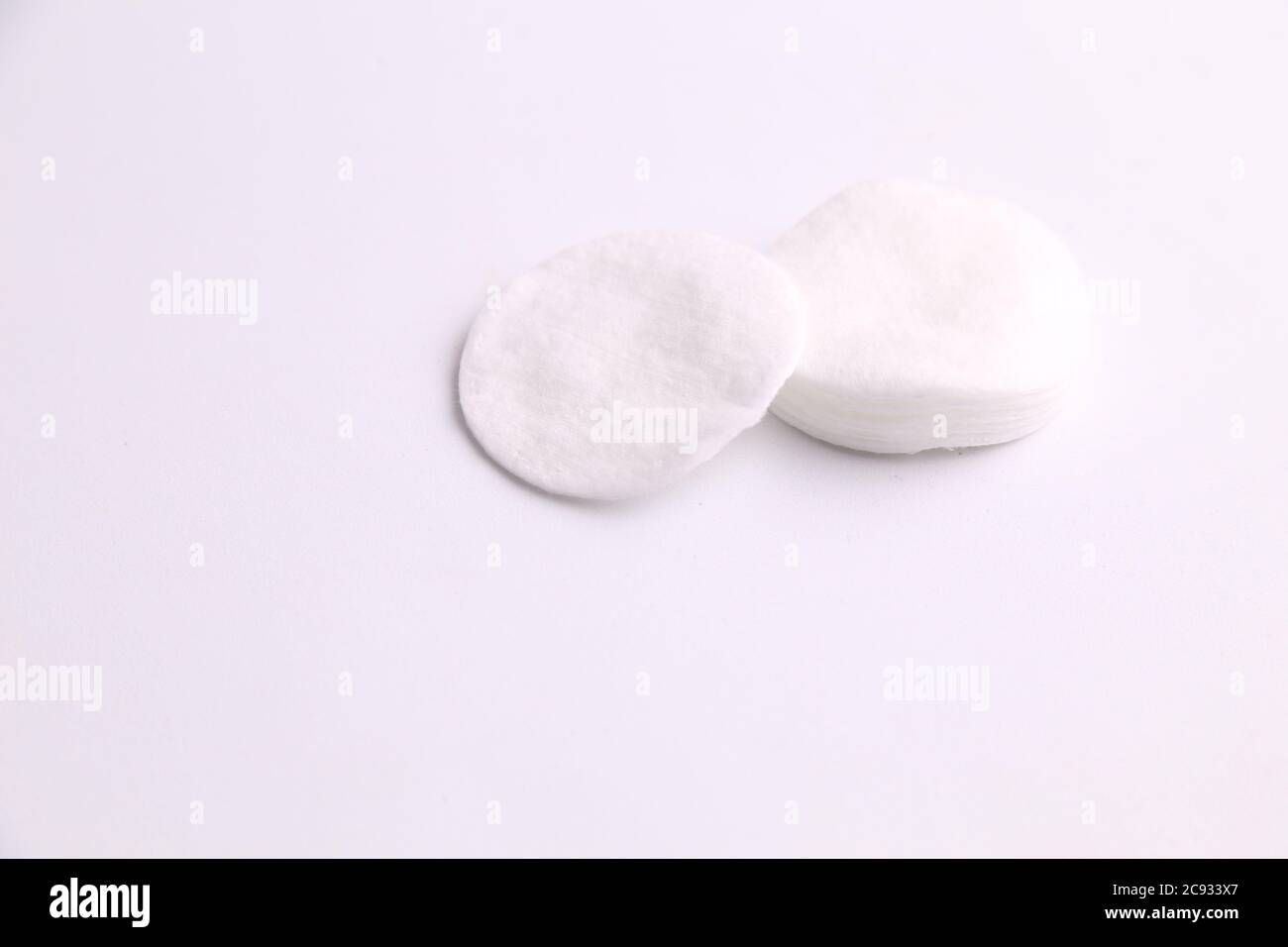 Closeup shot of the round cotton discs on a white background Stock ...