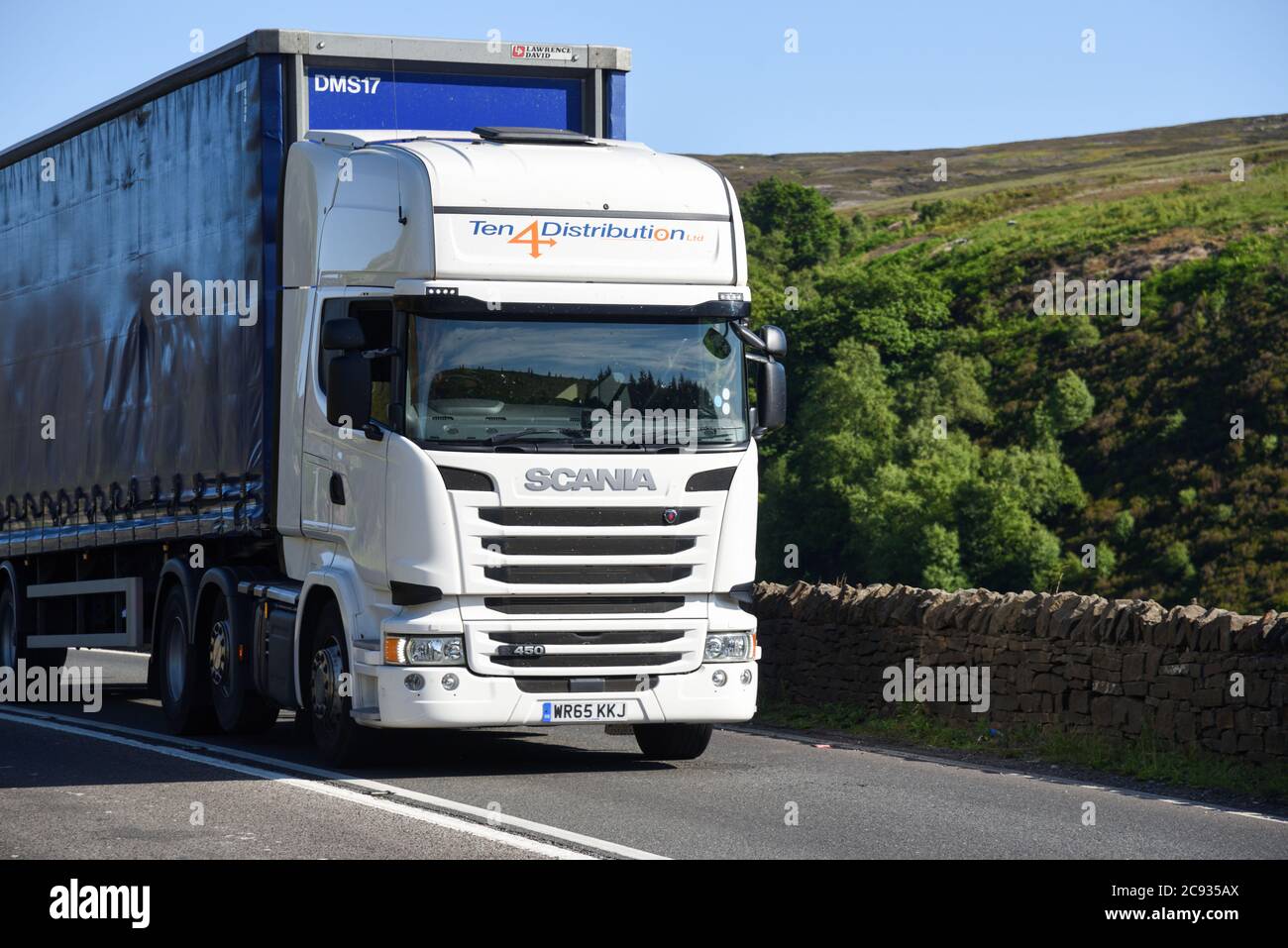 Scania truck pulling a curtainsider trailer on the A628 Woodhead Pass ...