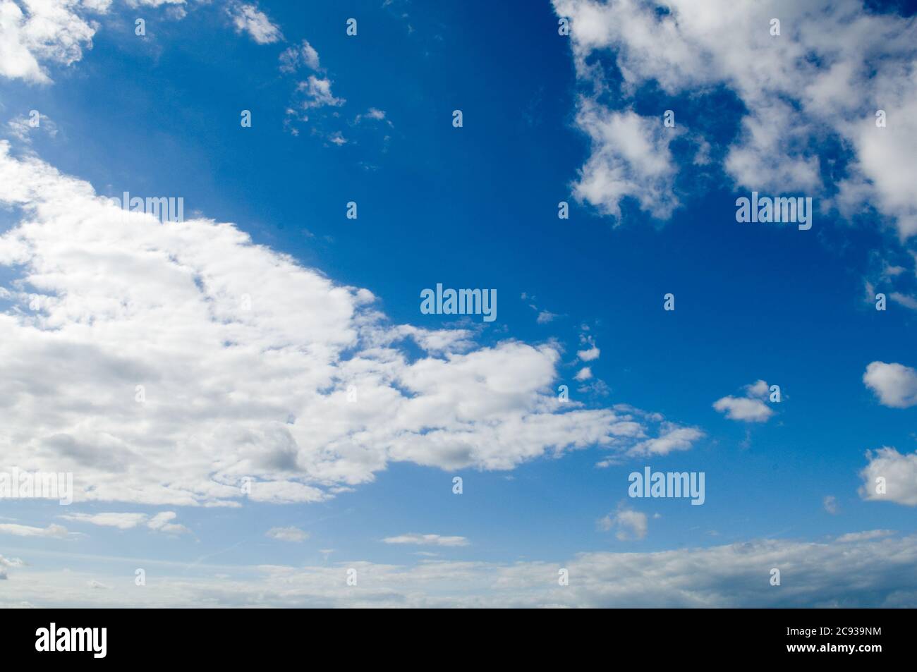 Bright blue sky with very little cloud Stock Photo - Alamy