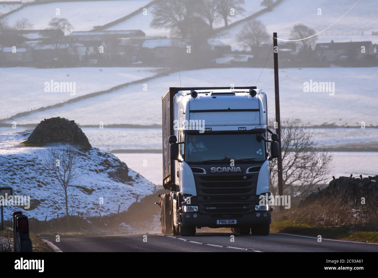 Scania container truck driving along the A623, Derbyshire in Winter ...