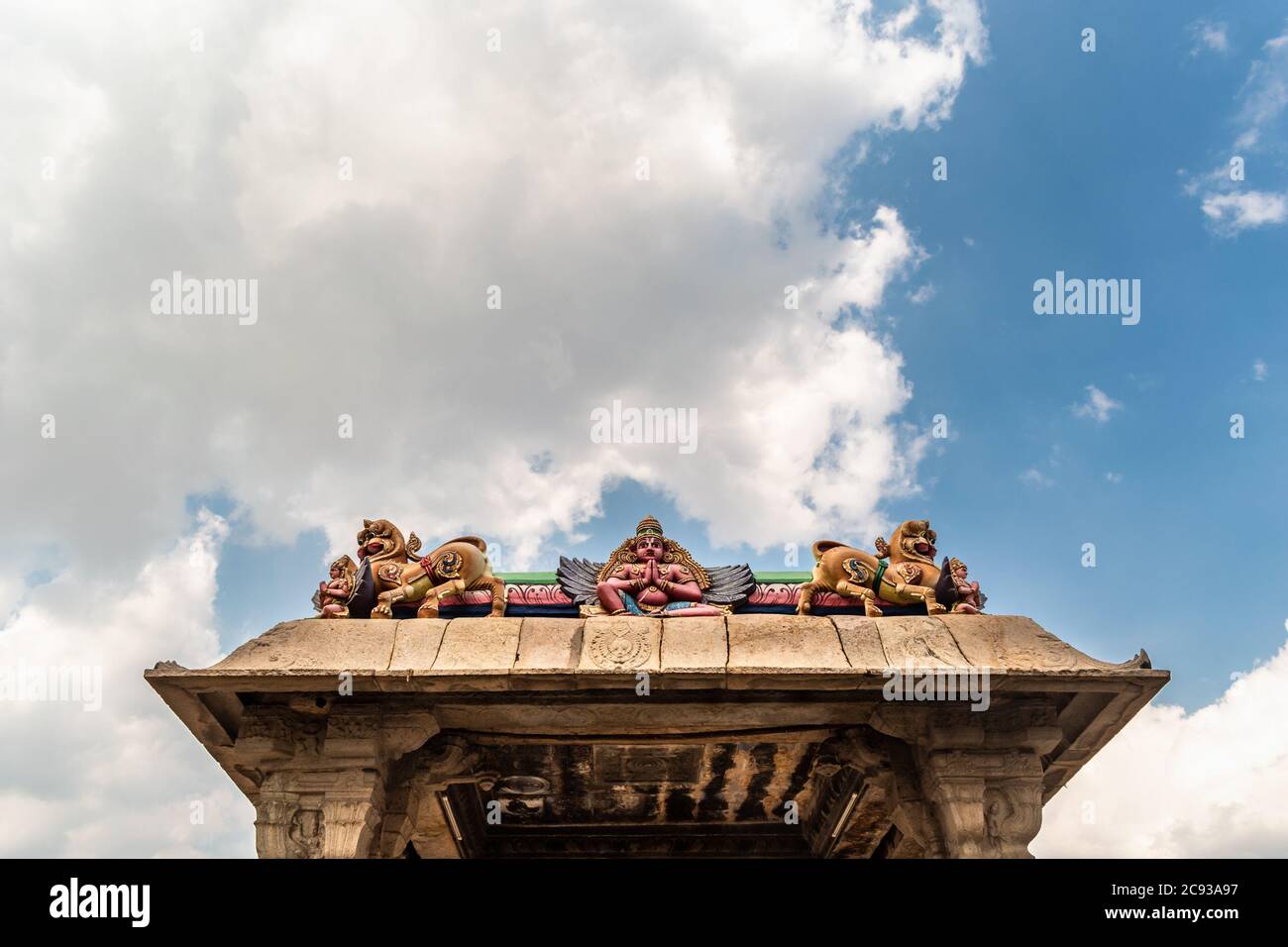 The roof of a mandapa hall with colorfully painted ornamental ...