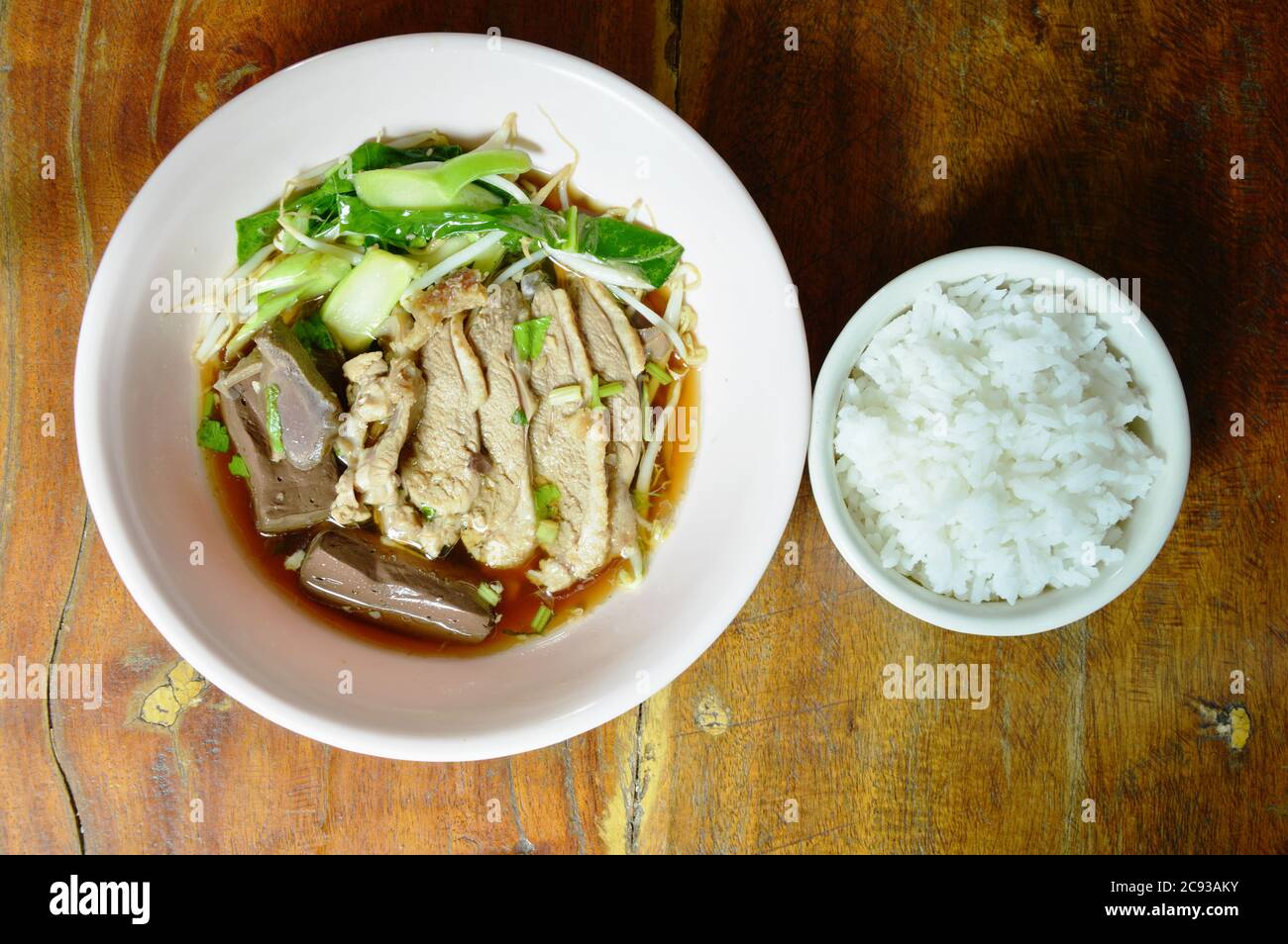 boiled duck meat and blood in brown Chinese herb soup on bowl eat ...
