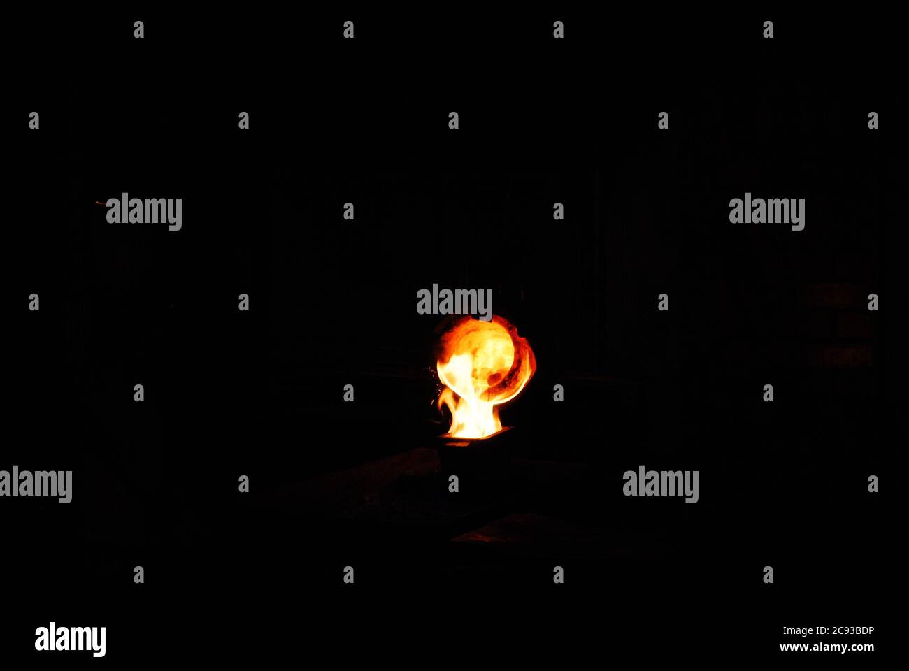 Melting furnace and a fire in the darkness Stock Photo - Alamy