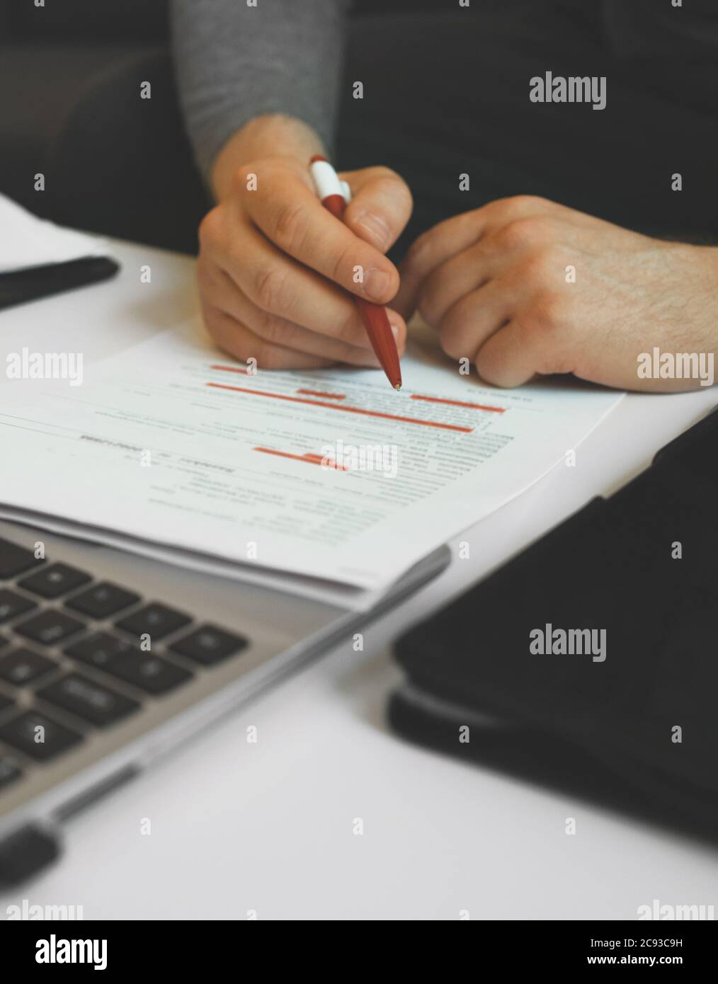 Businessman working with papers in the office Stock Photo - Alamy