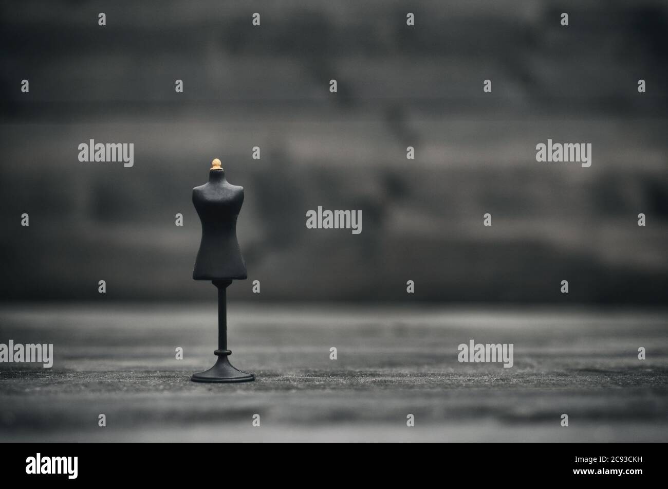 Fashion design concept, vintage mannequin stand on black wooden ...