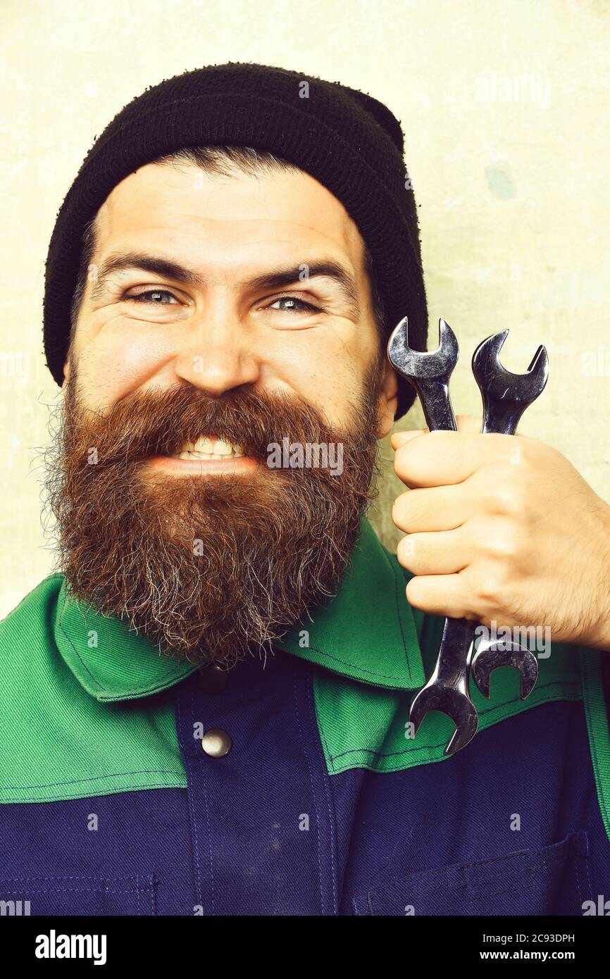Bearded man, long beard. Brutal caucasian mechanic, smiling happy ...
