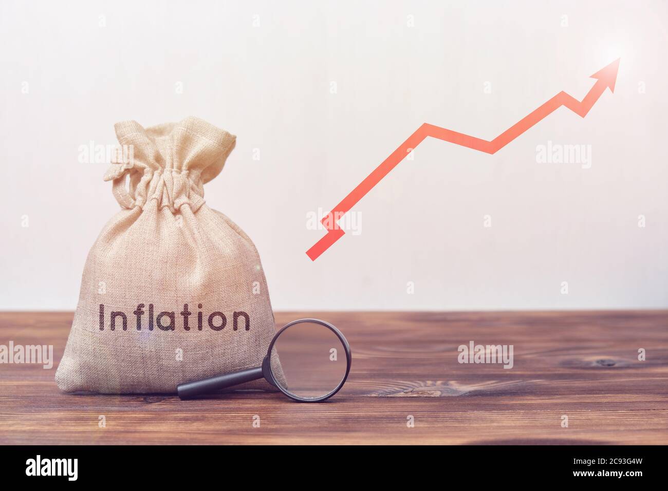 Inflation concept. Bag with a magnifying glass and an up arrow Stock ...