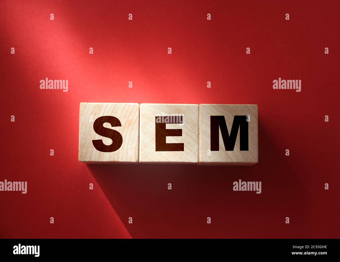 SEM letters on Wooden Blocks on red. Marketing business concept Stock ...