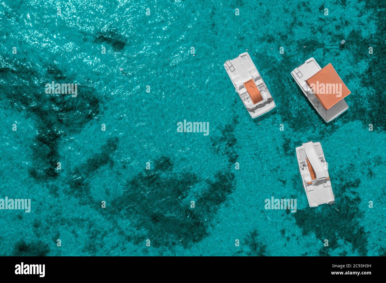 Three catamarans on the surface of the blue sea water top view Stock ...