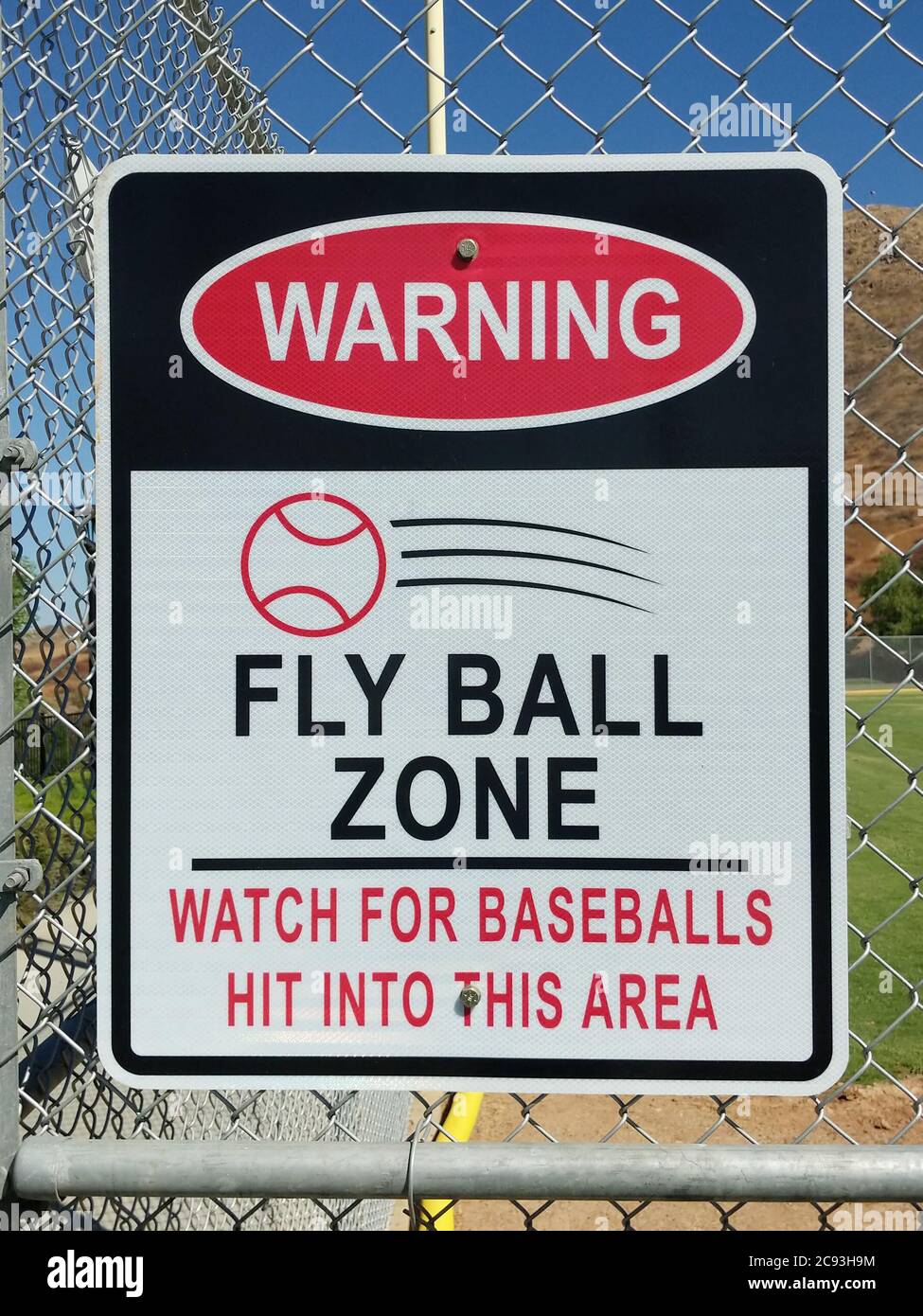 Baseball fly ball zone warning sign on fence Stock Photo - Alamy