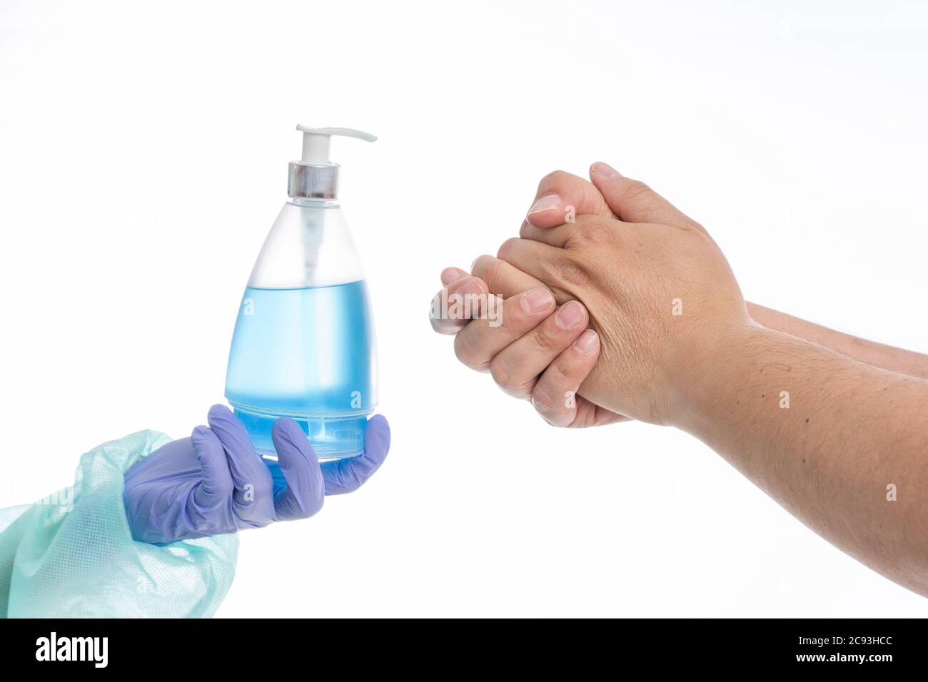 Doctor giving hand sanitizer gel to a patient to eliminate germs ...