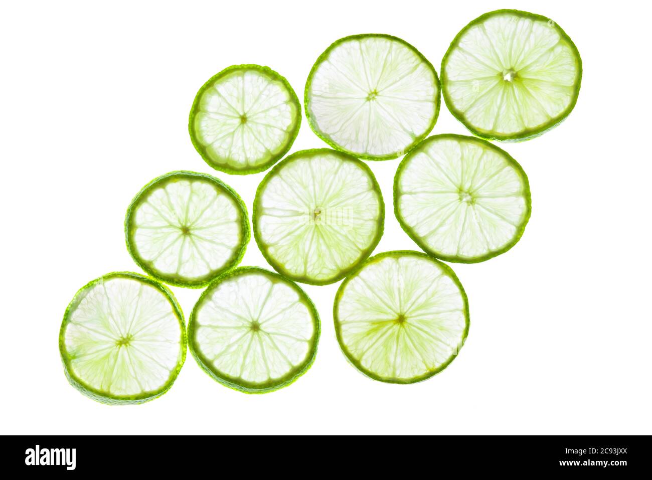 Green lime slices isolated on white background Stock Photo - Alamy