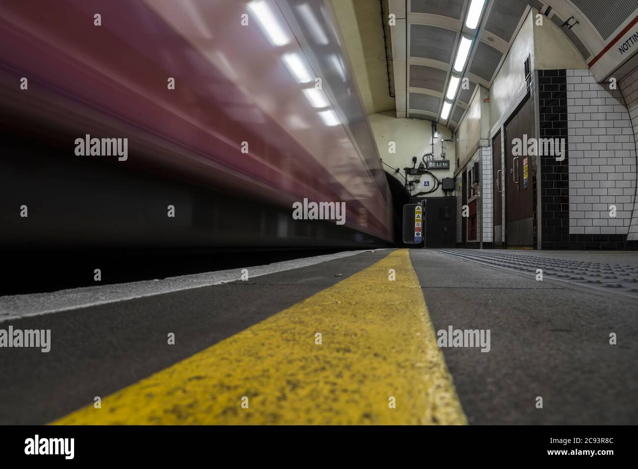 Moving subway on a platform in London Stock Photo - Alamy