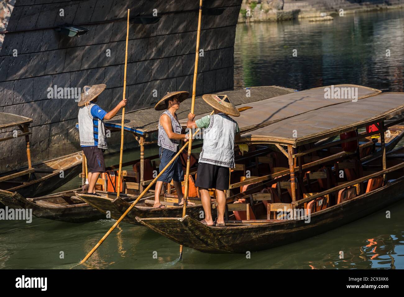 Feng Huang, China - August 2019 : Three Chinese men wearing traditional ...