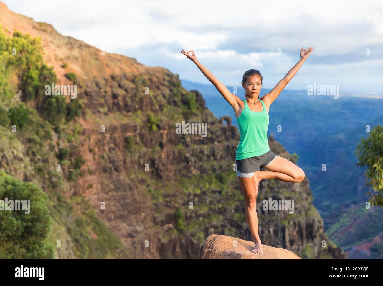 Yoga tree balance pose with open branch arms woman Stock Photo - Alamy