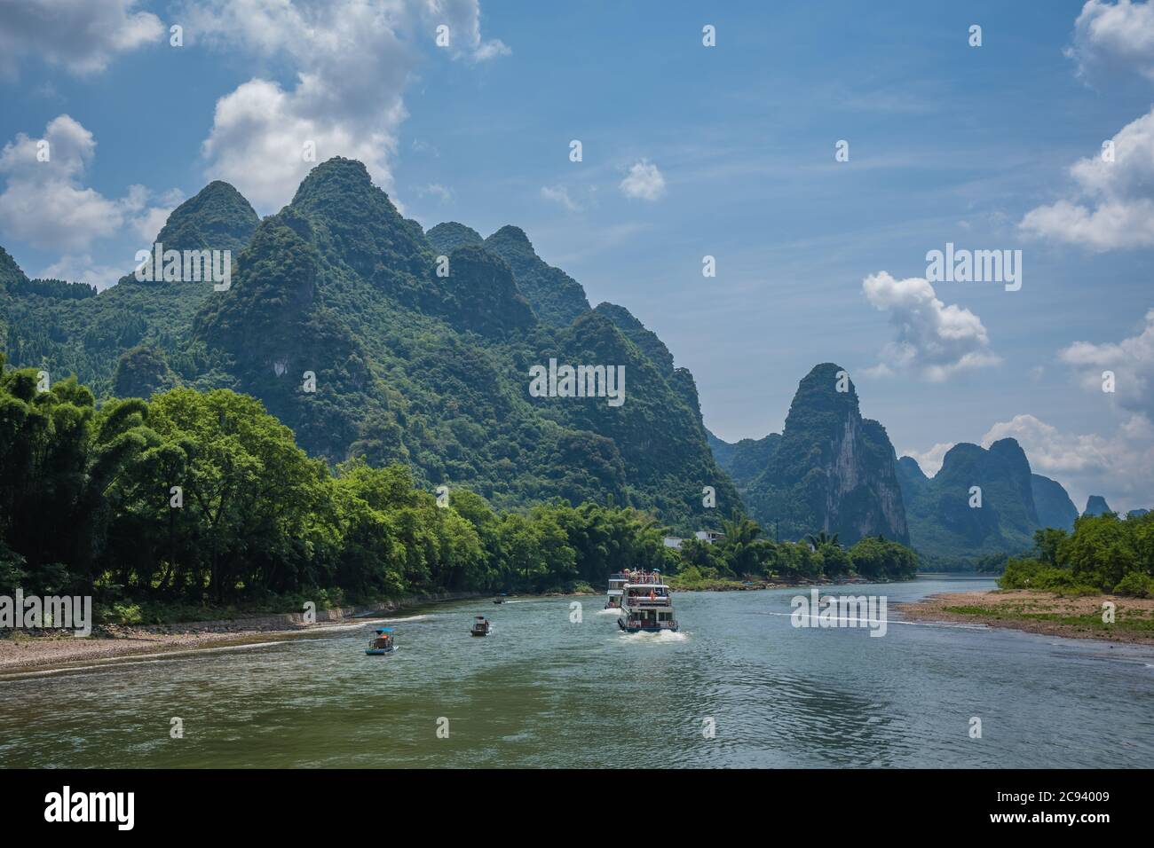 Yangshuo, China - August 2019 : Two sightseeing boats carrying tourists ...