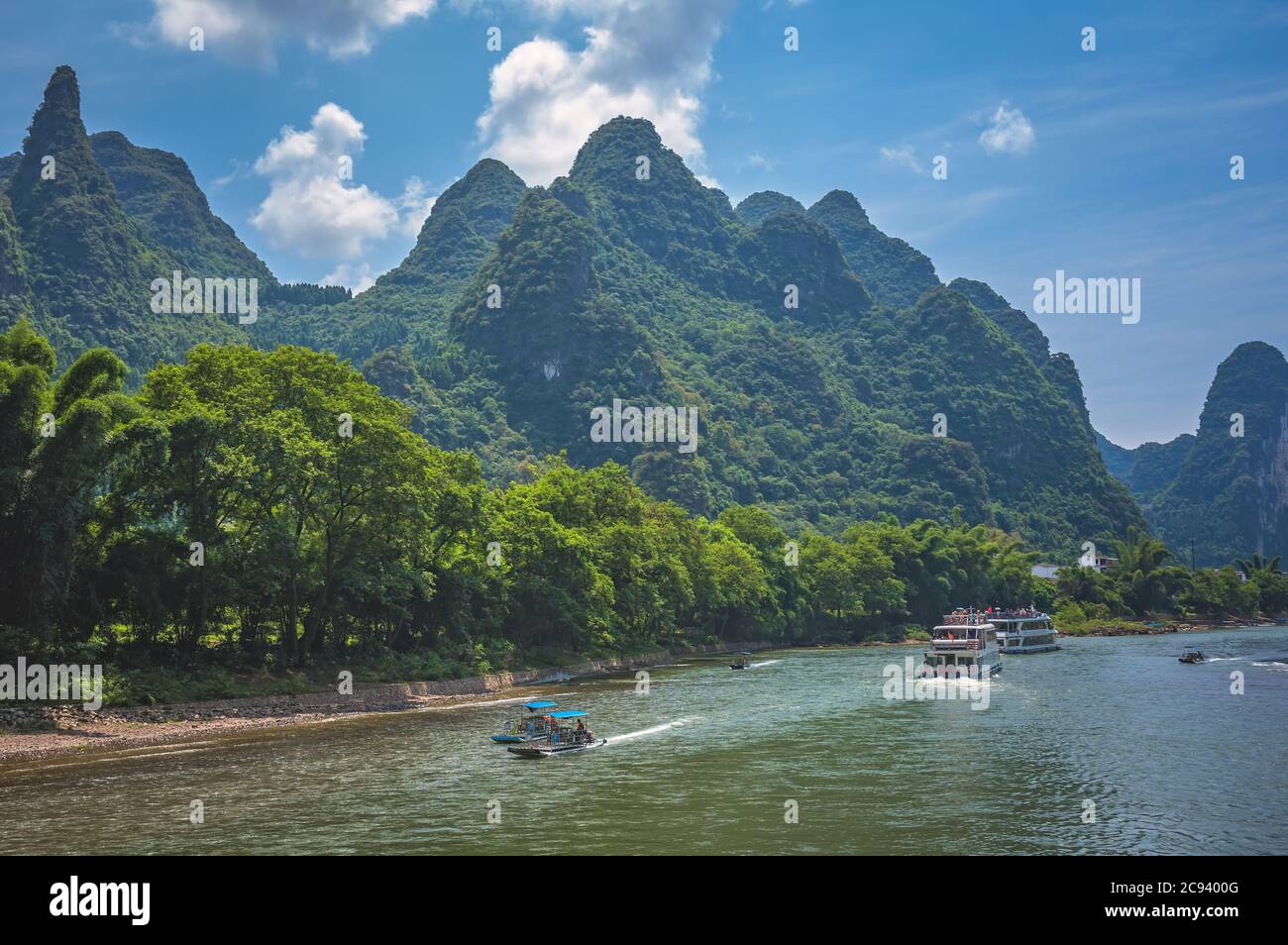 Yangshuo, China - August 2019 : Two sightseeing boats carrying tourists ...