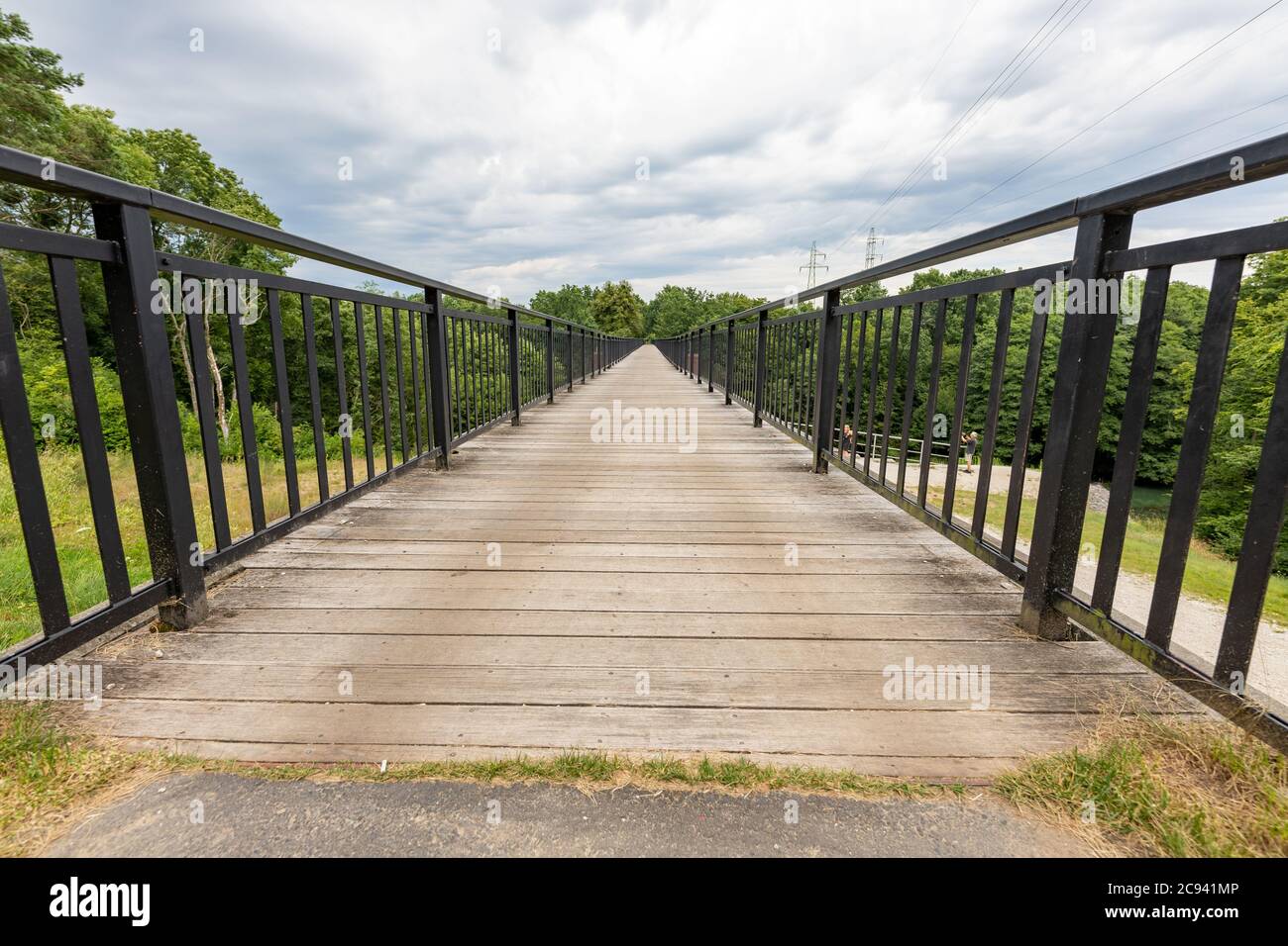 Metal footbridge over the river. Pedestrian crossing over a gorge in ...