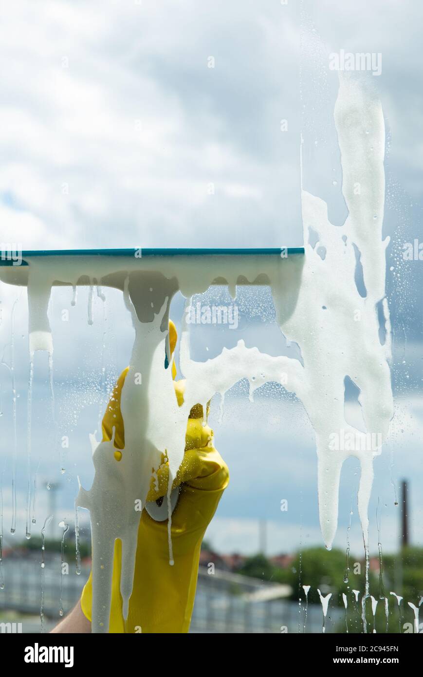 Cleaning in a house or apartment. Removing dirt from windows and ...