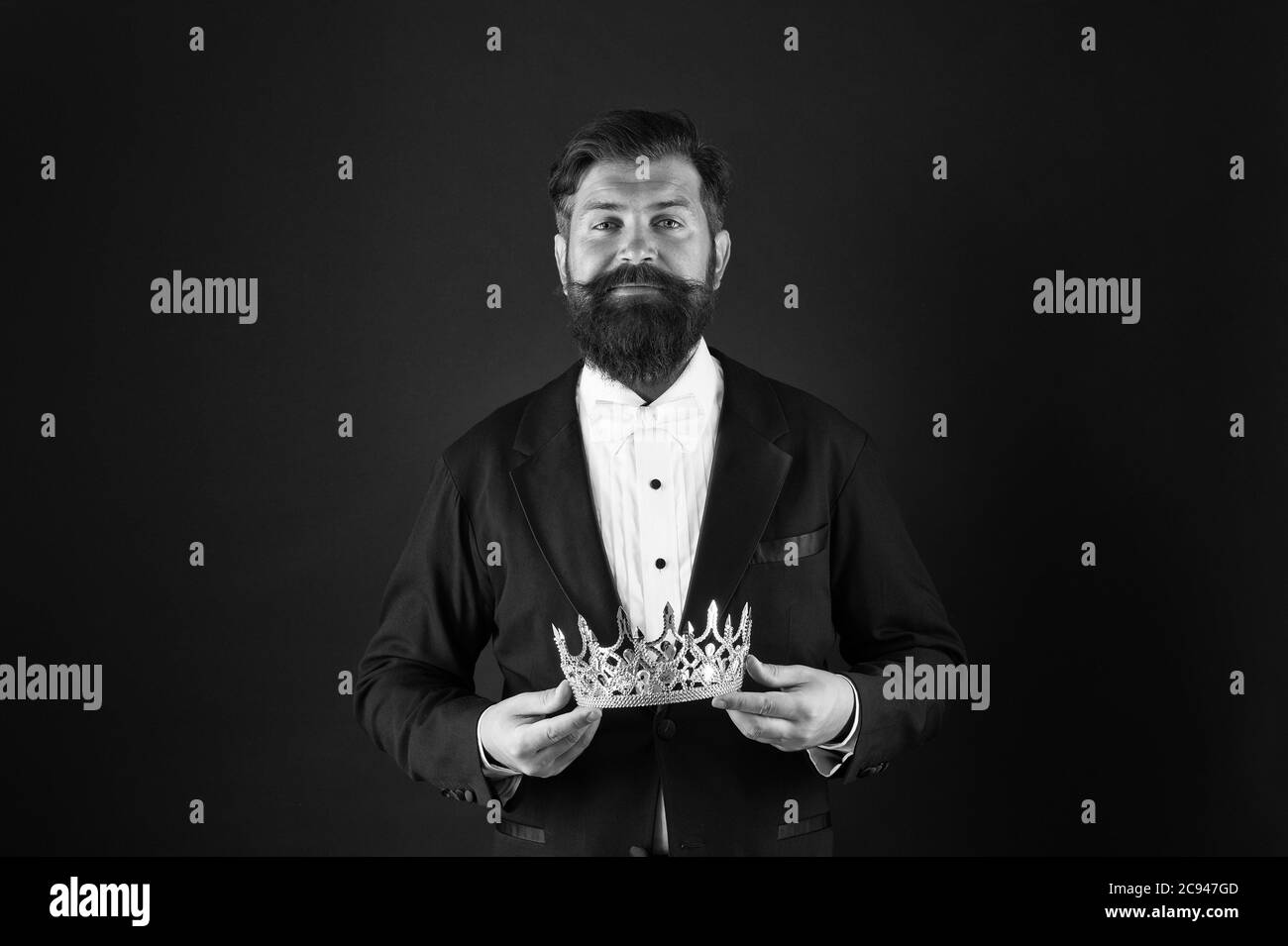 Now come and make it worth. Crown in hands. Handsome man give crown ...