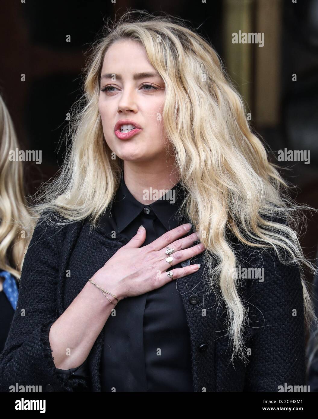 Amber Heard gives a statement outside the Royal Courts of Justice on ...