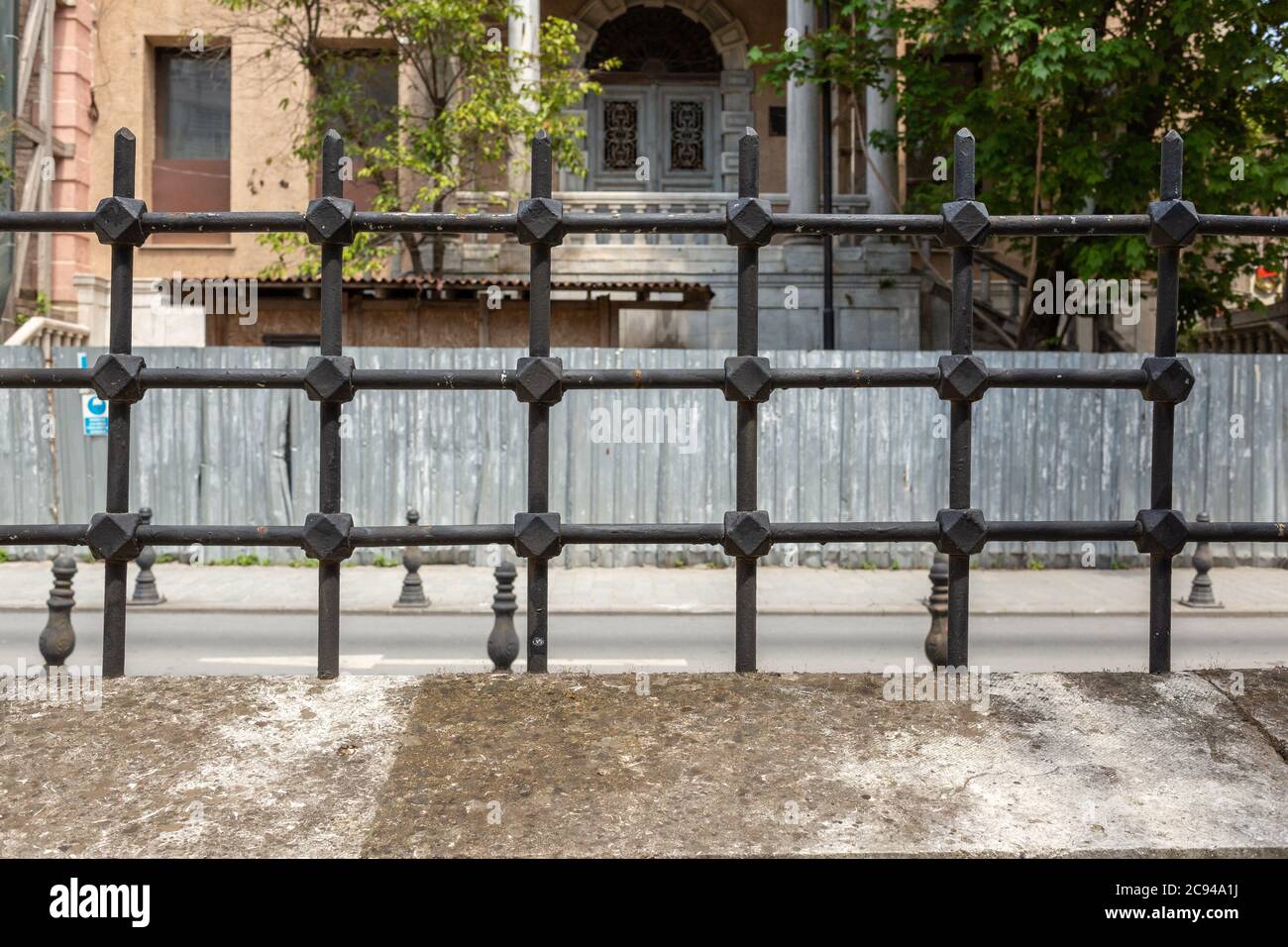 Historical protection fence from cast iron material squarely positioned ...