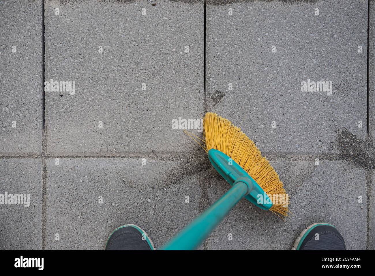 Sweeping Jointing Sand in Paver Patio Installation Stock Photo - Alamy