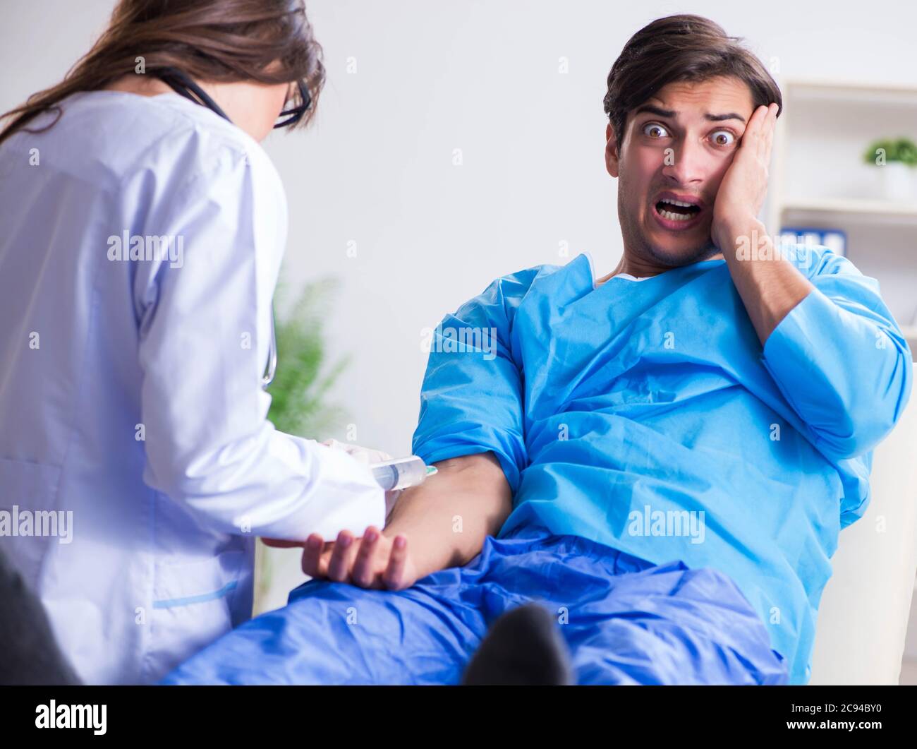 The scared patient man getting ready for flu shot Stock Photo - Alamy