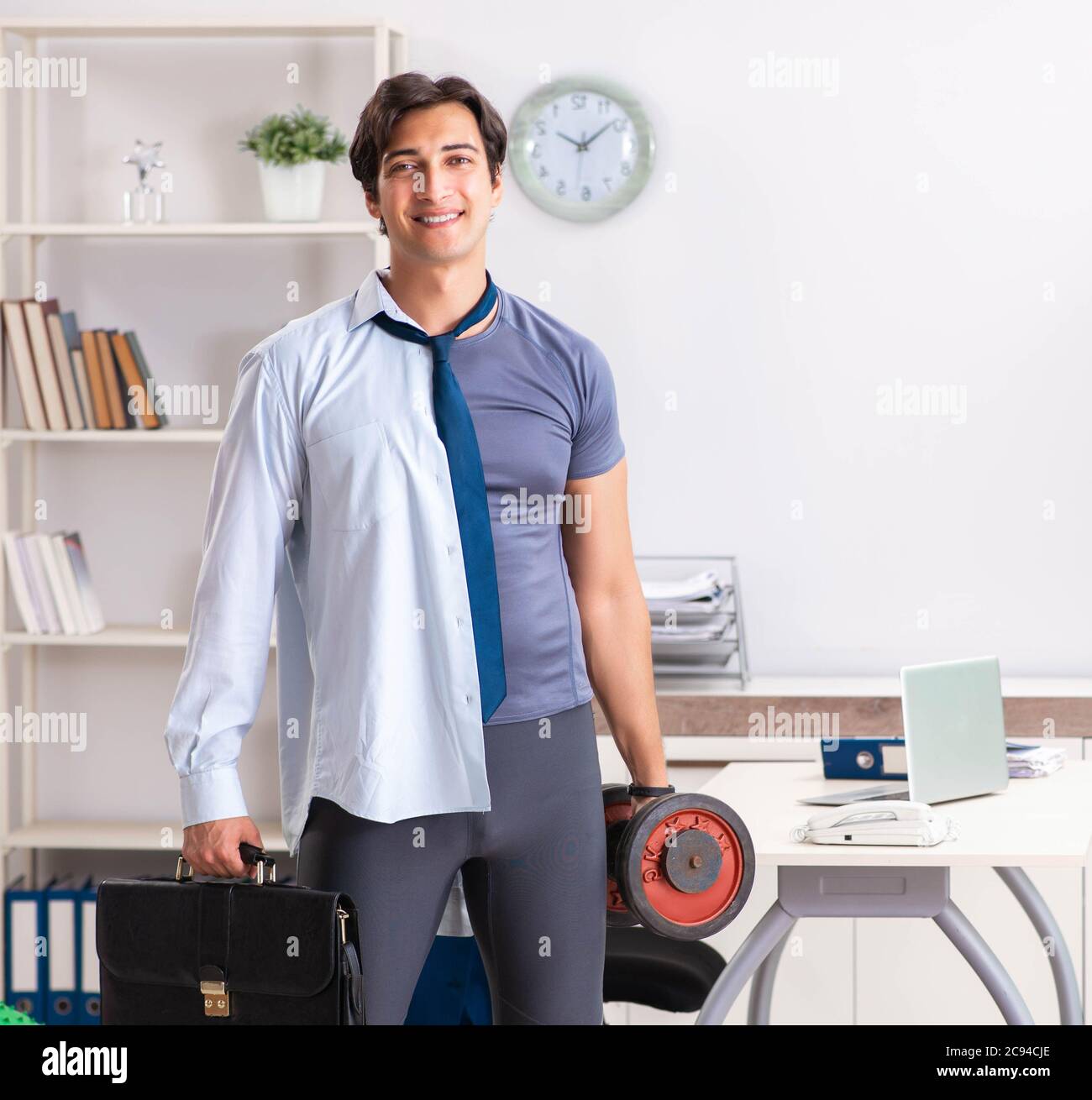 The employee combining work and healthy lifestyle Stock Photo - Alamy