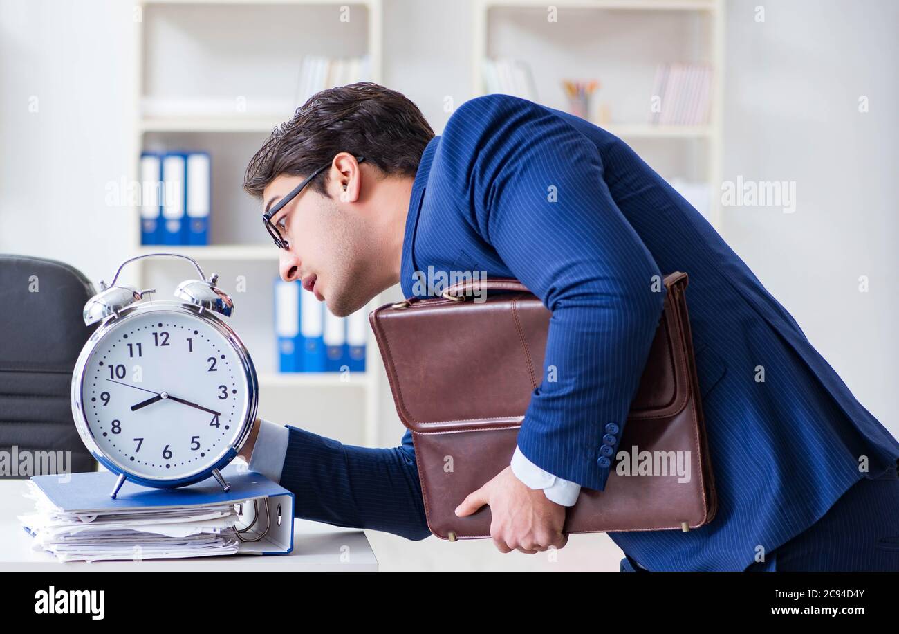 The businessman in bad time management concept Stock Photo - Alamy