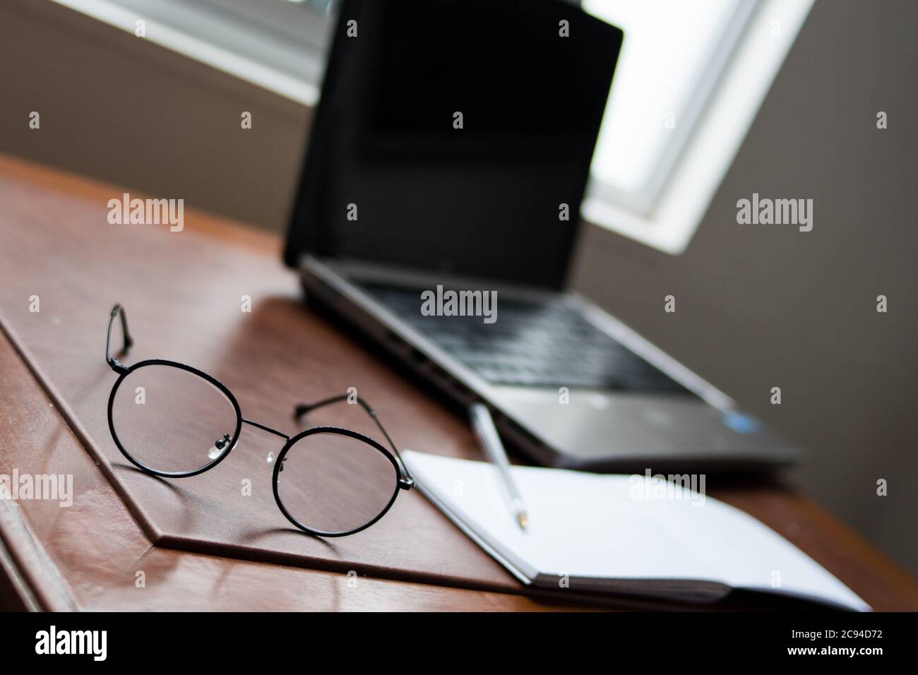 Wooden desk laptop glasses hi-res stock photography and images - Alamy