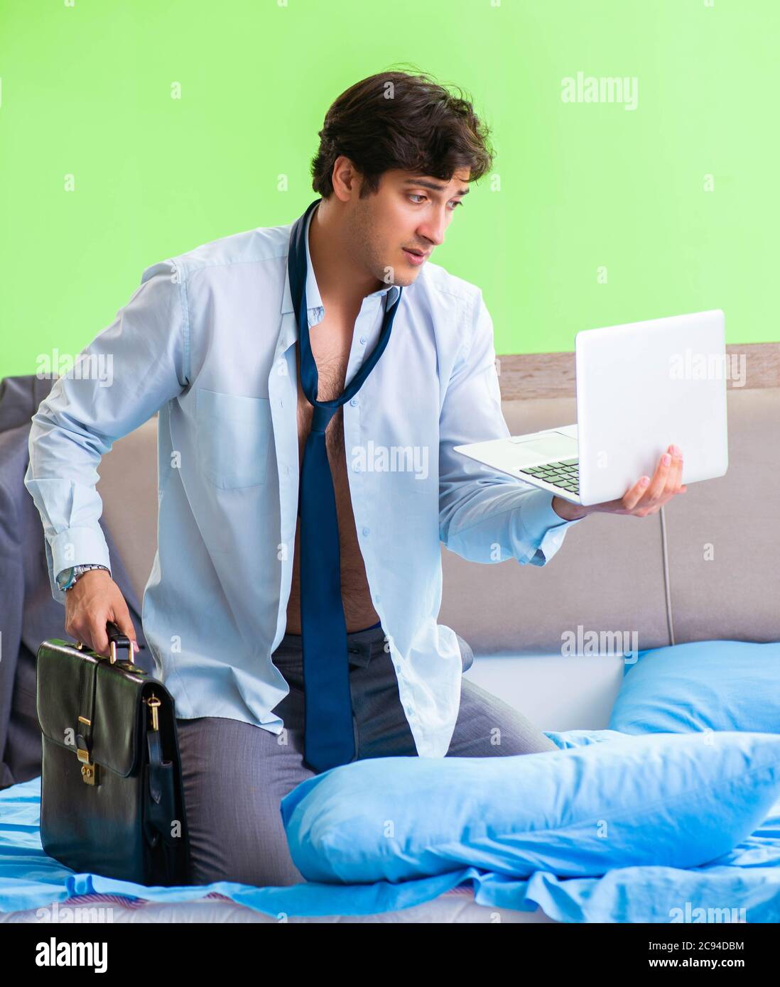 The employee in the bedroom being late for his job Stock Photo - Alamy