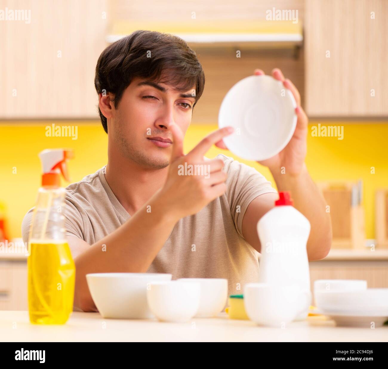 Young man washing dishes detergent hi-res stock photography and images ...