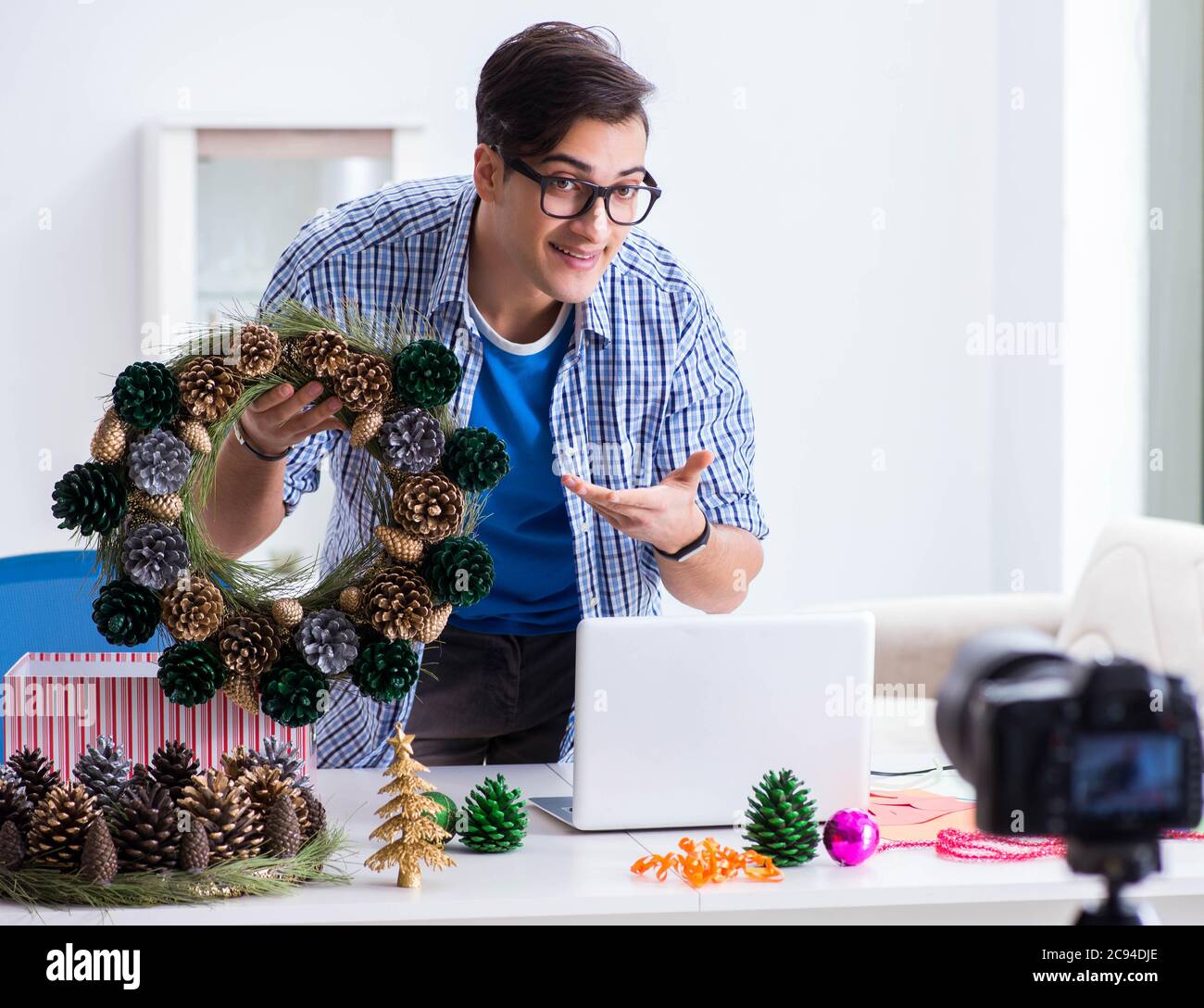 The young vlogger recording video doing christmas decoration Stock ...