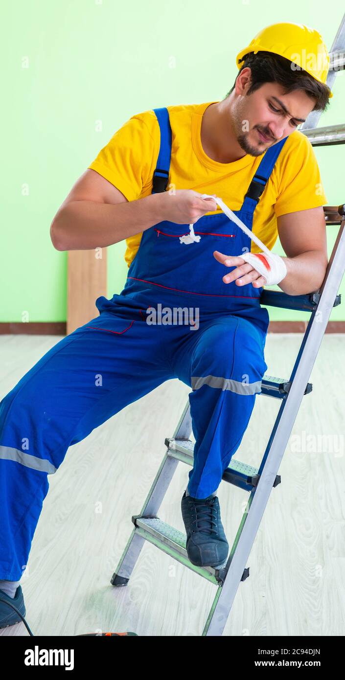 The injured worker at the work site Stock Photo - Alamy