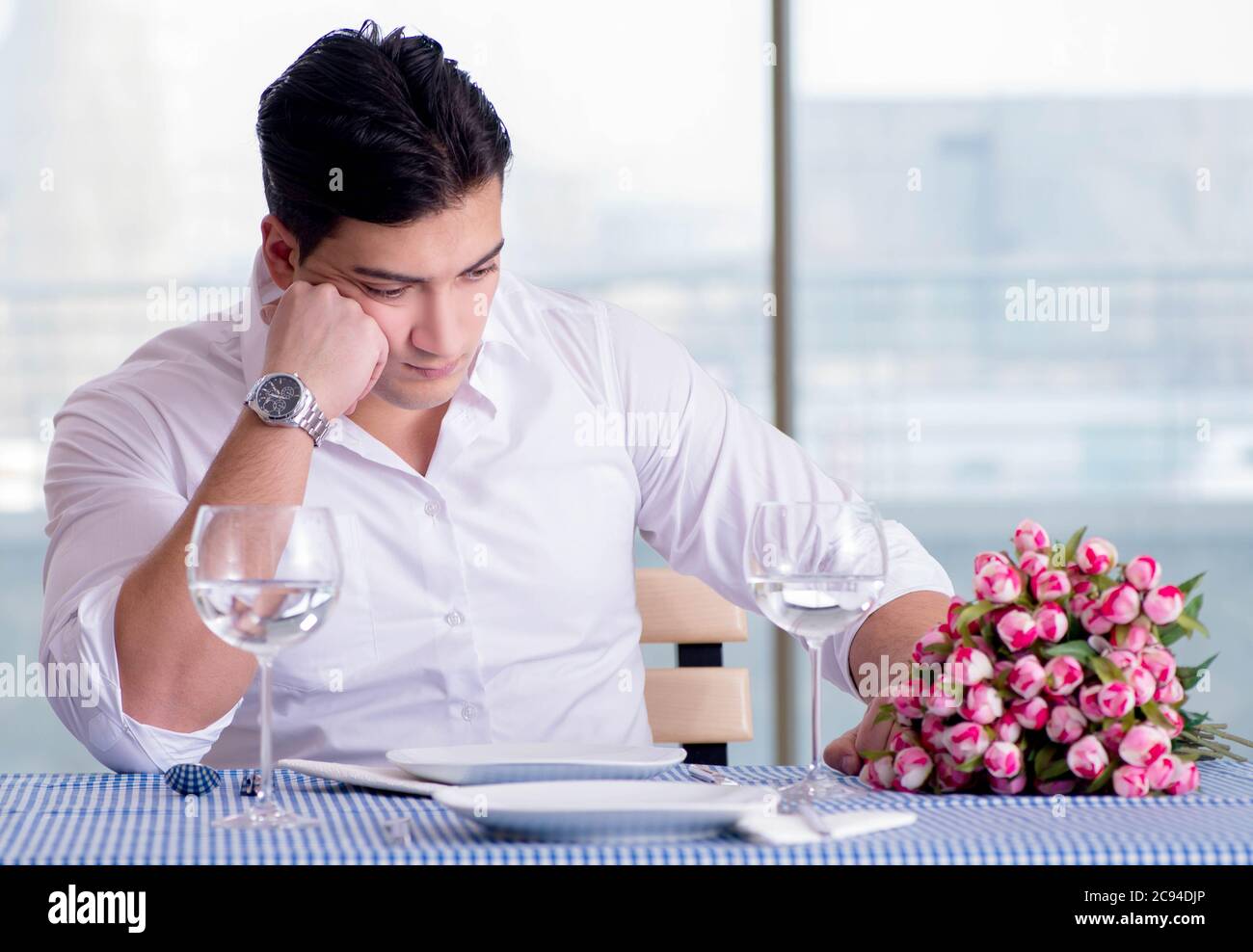 The handsome man alone in restaraunt on date Stock Photo - Alamy