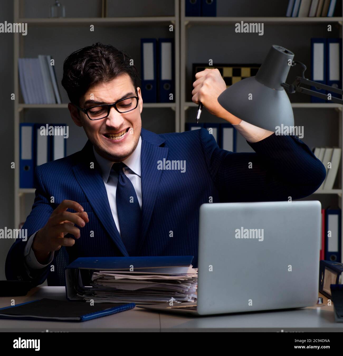 The employee working late to finish important deliverable task Stock ...