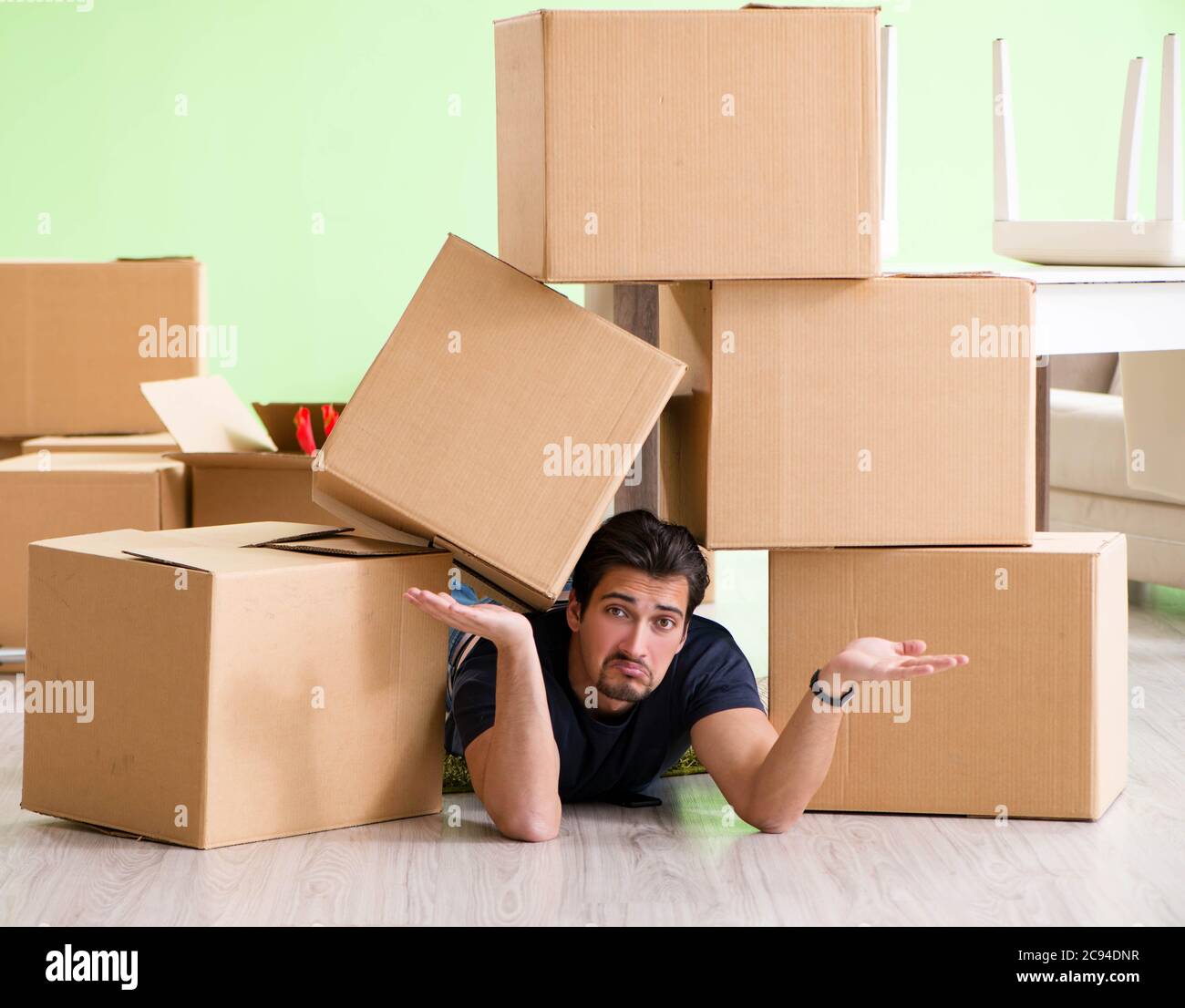 The man moving house with boxes Stock Photo - Alamy