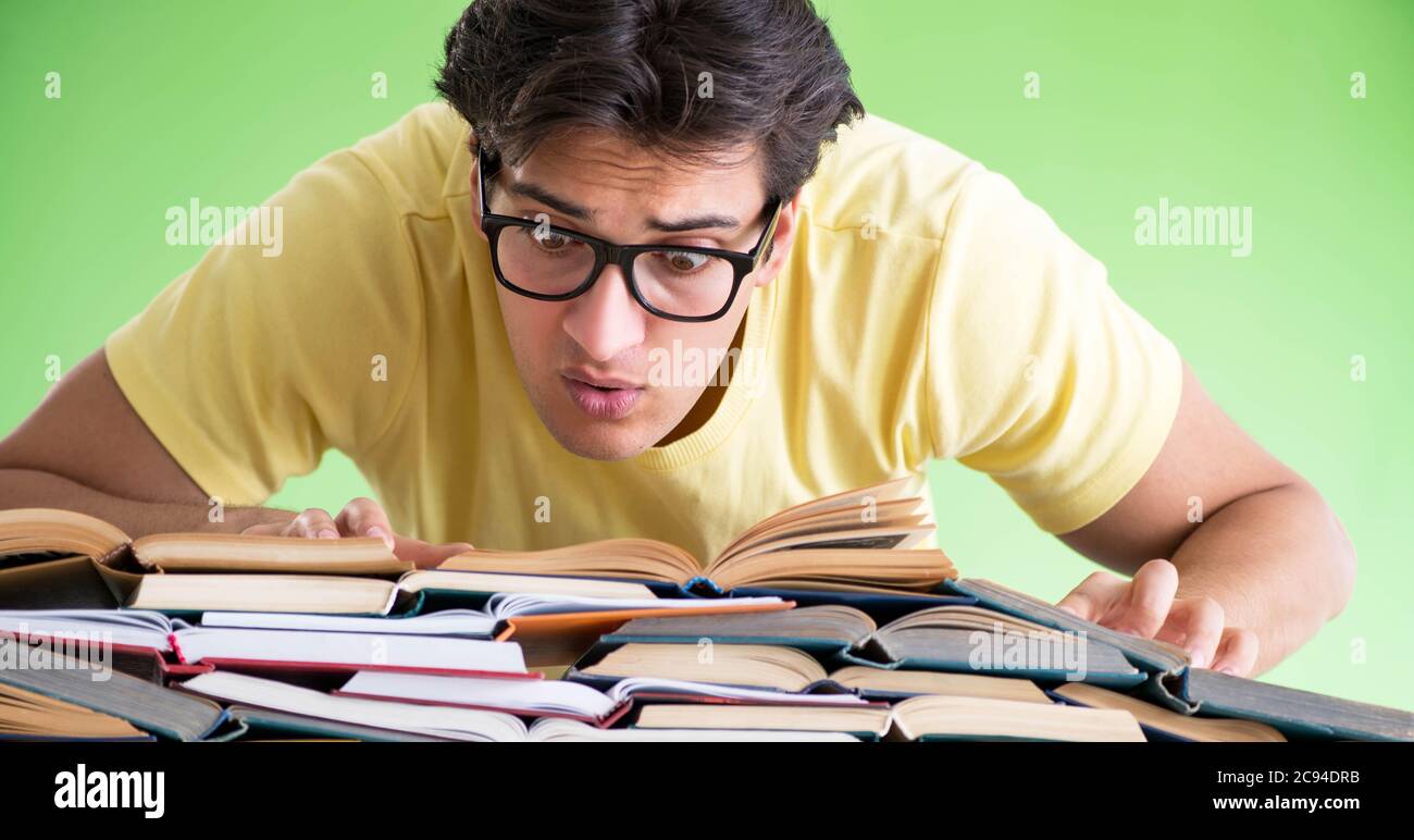 The student with too many books to read before exam Stock Photo - Alamy