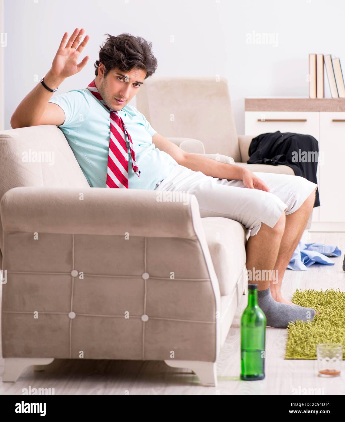 The young drunk handsome man after party at home Stock Photo - Alamy