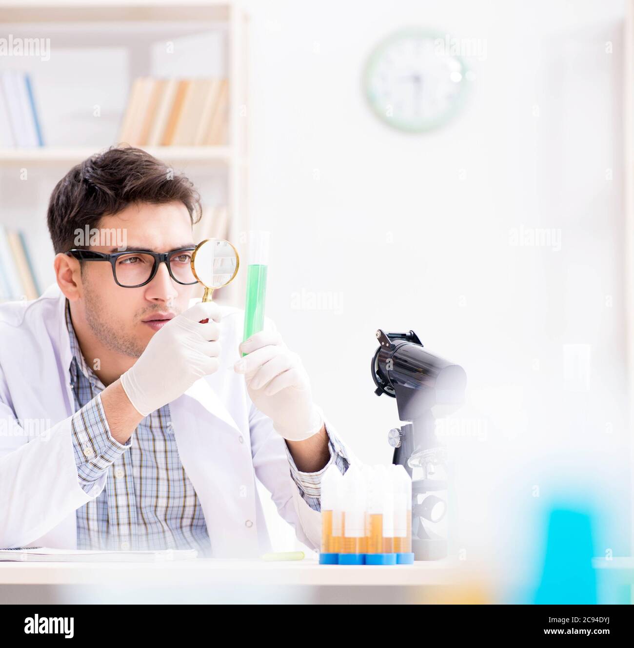 Chemistry student doing chemical experiments at classroom activity ...