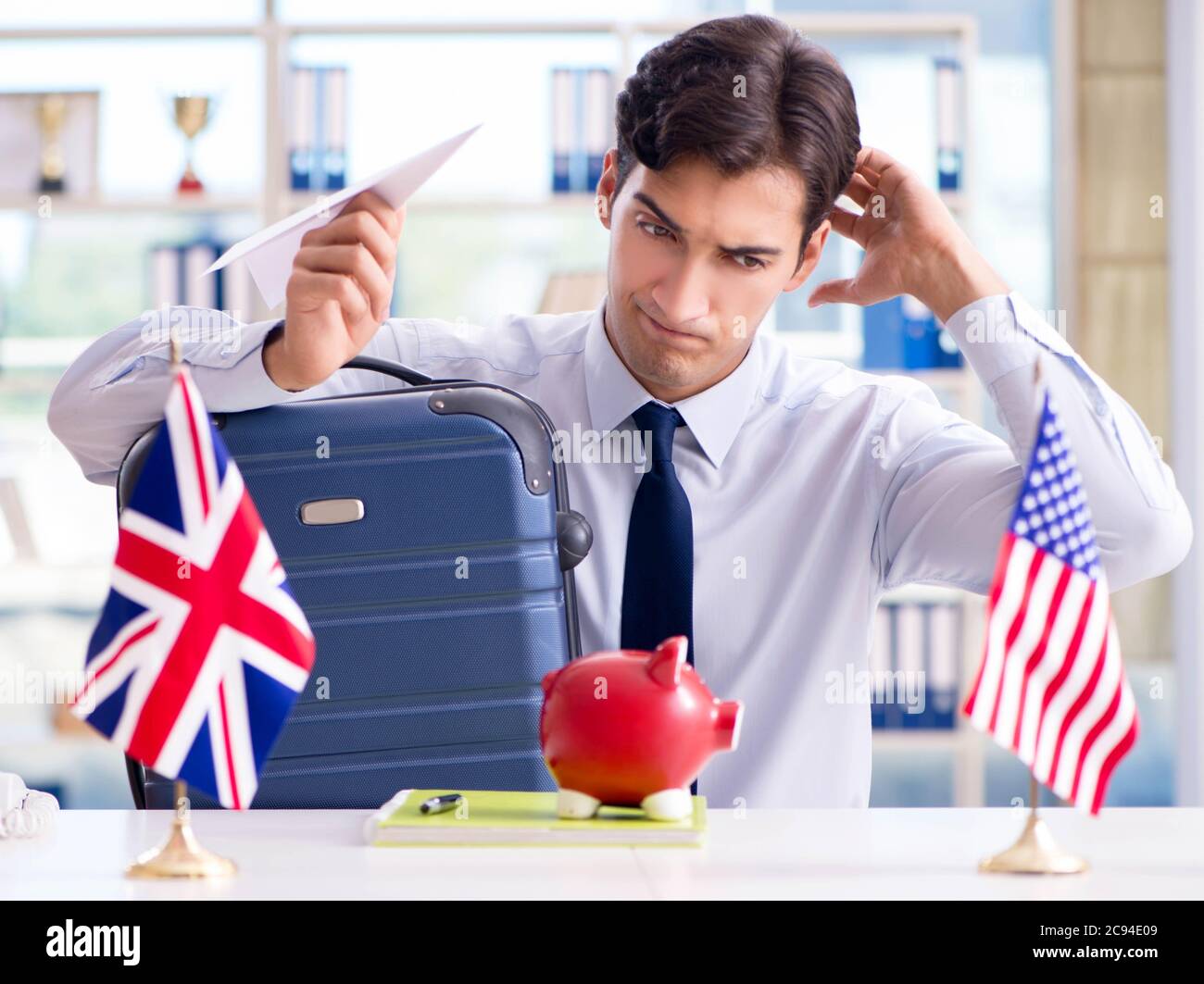 The sales agent working in travel agency Stock Photo - Alamy