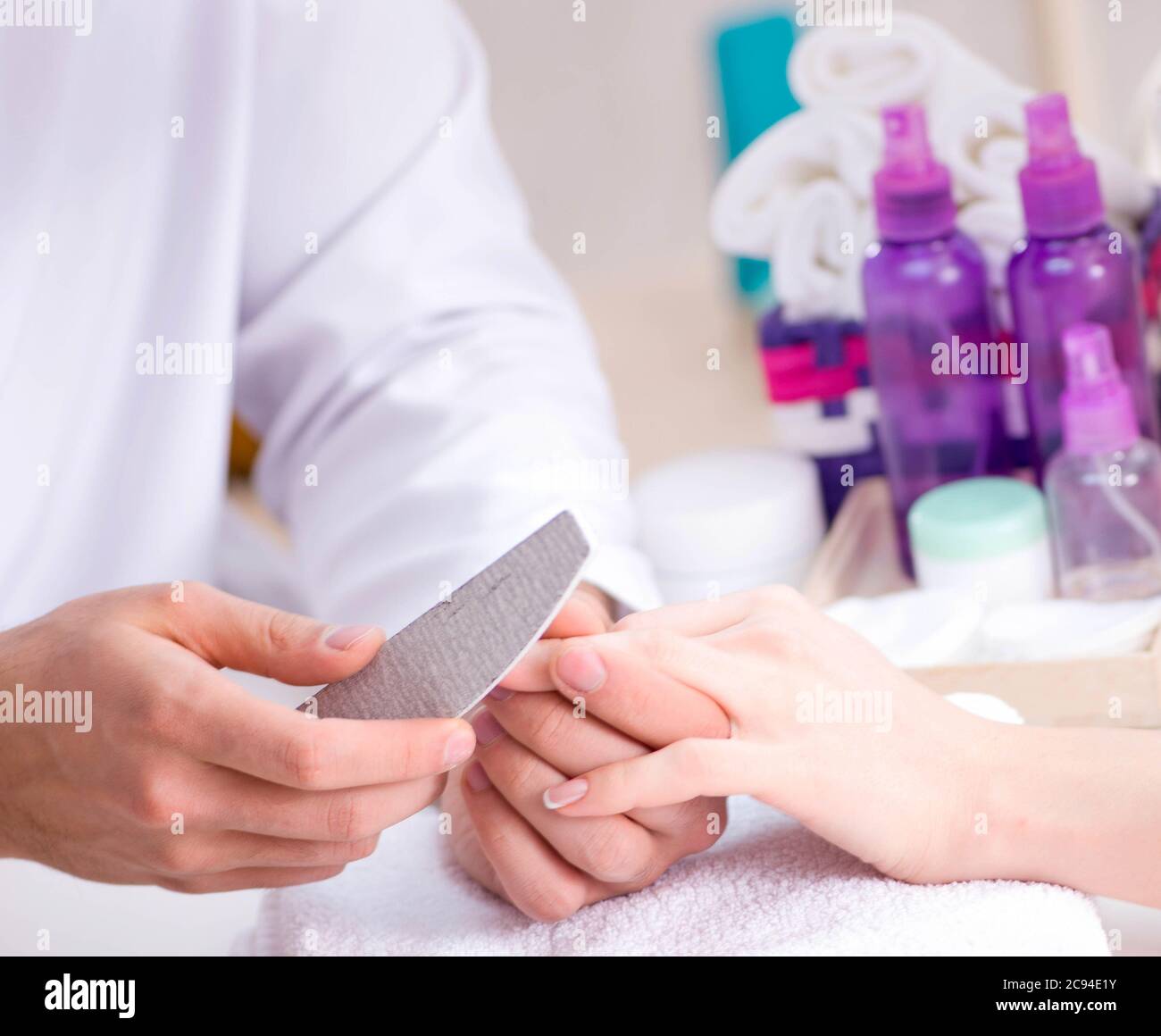The hands during manicure care session Stock Photo - Alamy