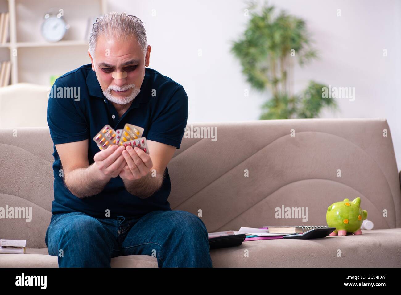 Old man in budget planning concept Stock Photo - Alamy